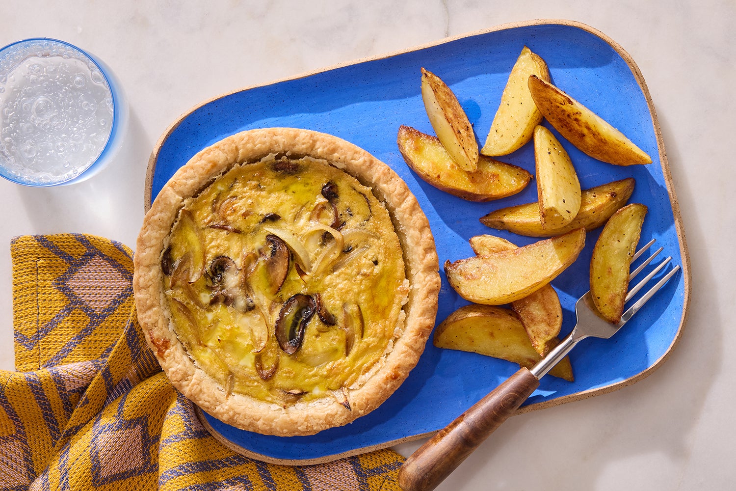 Recipe: Truffle & Fontina Quiche with Mushrooms & Roasted Potato Wedges ...